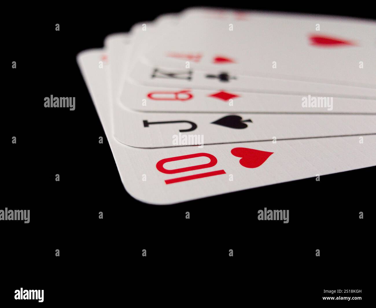 A deck of cards with the top card showing a king and the bottom card ...