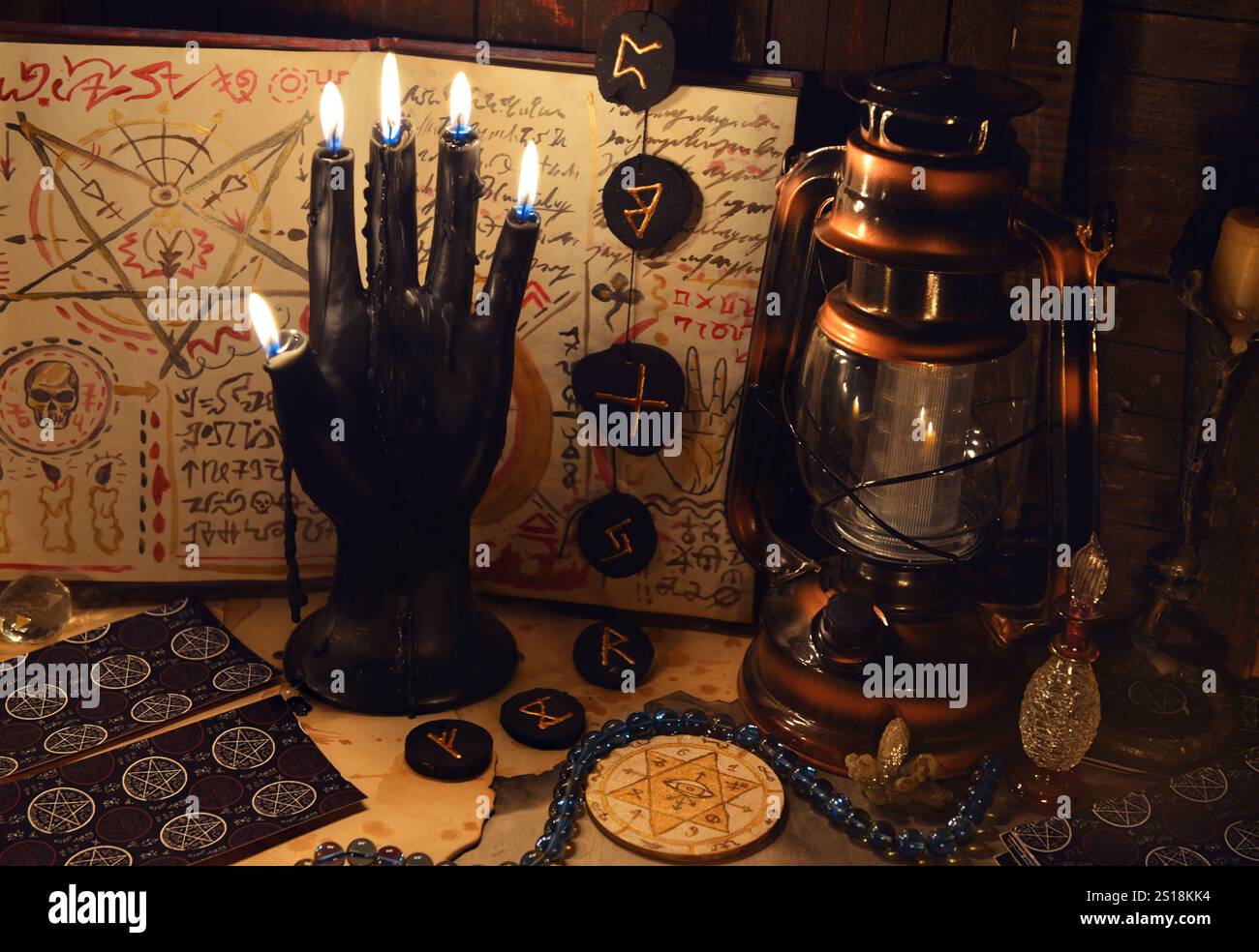 Mystic still life with tarot cards, runes and black candle as scary ...