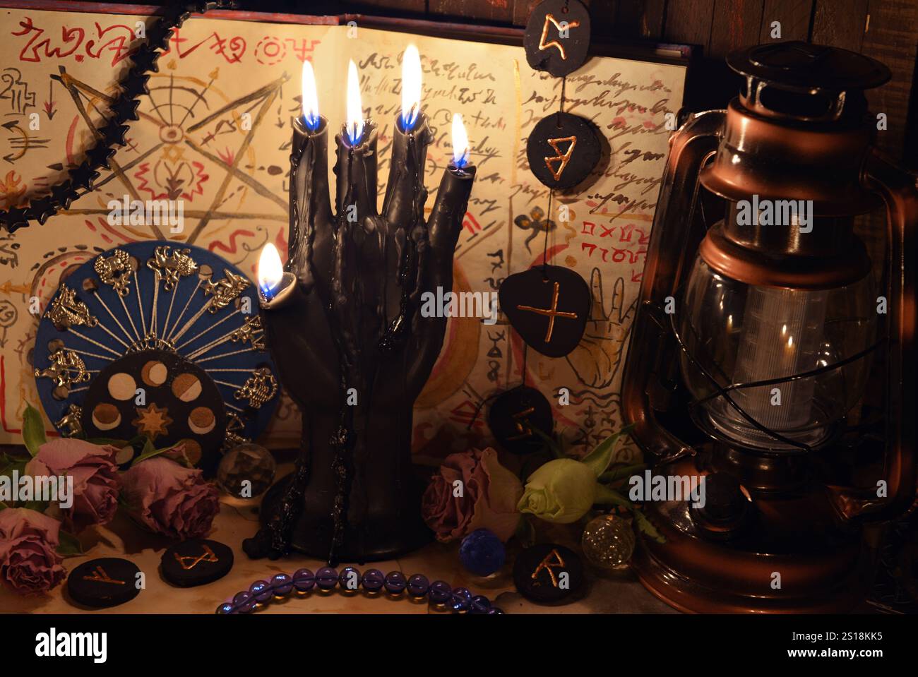 Mystic still life with runes, pentagram and magic spell book on old ...