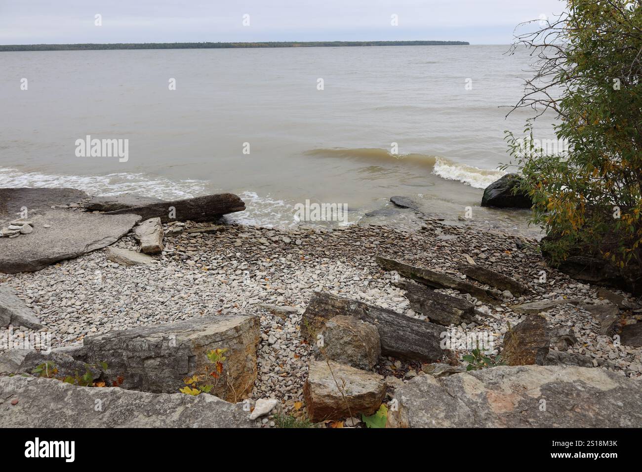 large blocks of limestone discarded from a quarry on lakeshore Stock ...