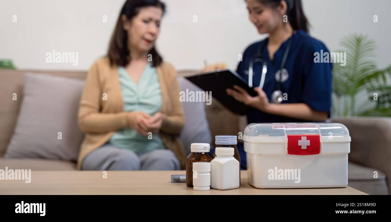 Caregiver consults elderly patient home setting medical guidance warm ...