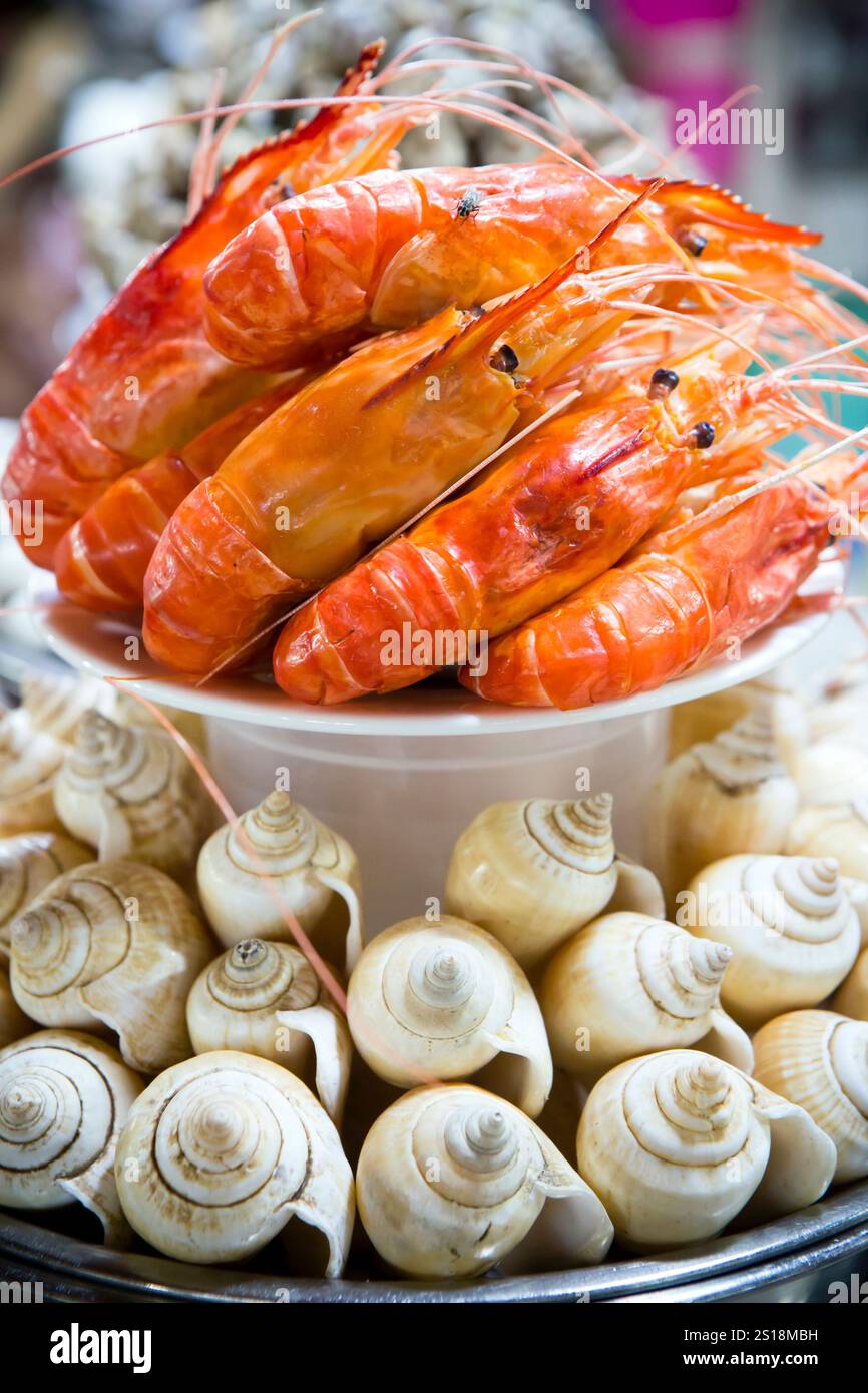 Cooked shrimp assortment and food display at a street food stall ...