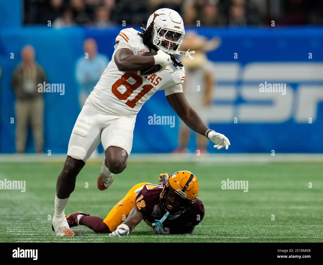 Tight end Juan Davis (Texas Longhorns, #81) escapes the tackle attempt ...