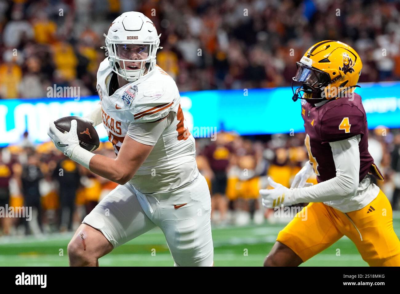 Tight end Gunnar Helm (Texas Longhorns, #85) carries the ball for a game-winning touchdown score ...