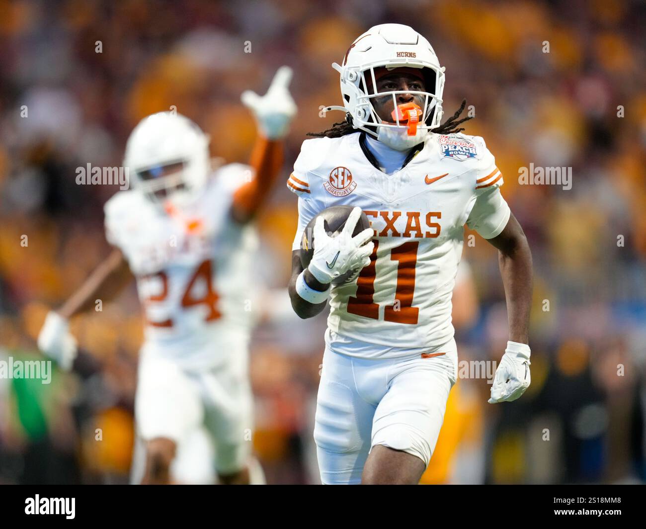 Wide receiver Silas Bolden (Texas Longhorns, #11) scores a touchdown on a 75-yard punt return in ...