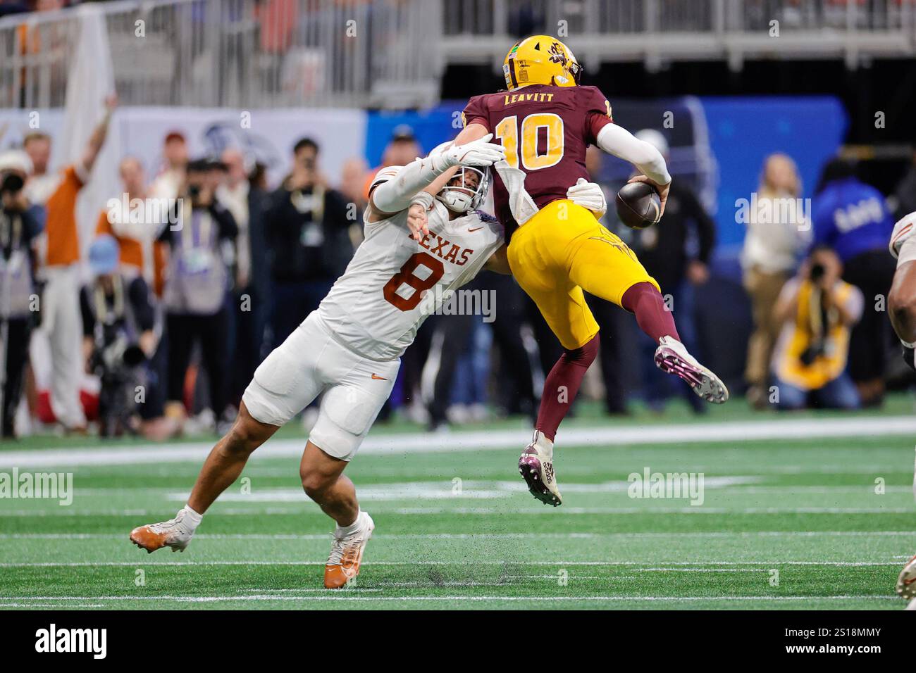 January 1, 2025: Sam Leavitt (10) of Arizona State is brought down by ...