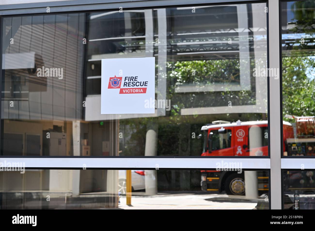 Fire Rescue Victoria, or FRV, logo on the window of a fire station ...