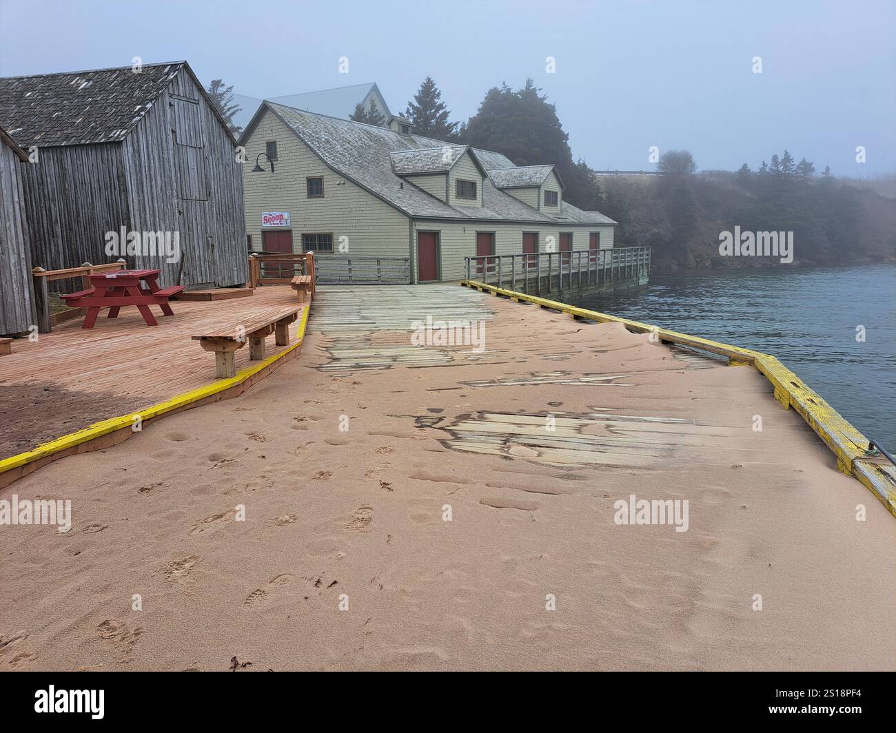 Large accumulation of drifting sand from the winter on the boardwalk at ...