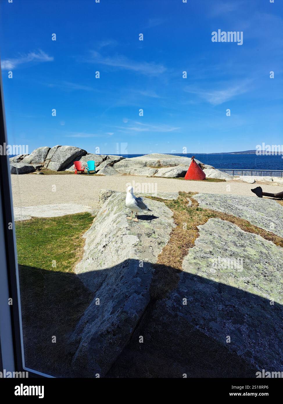 Adirondack chairs and red can buoy in Peggy's Cove, Nova Scotia, Canada ...