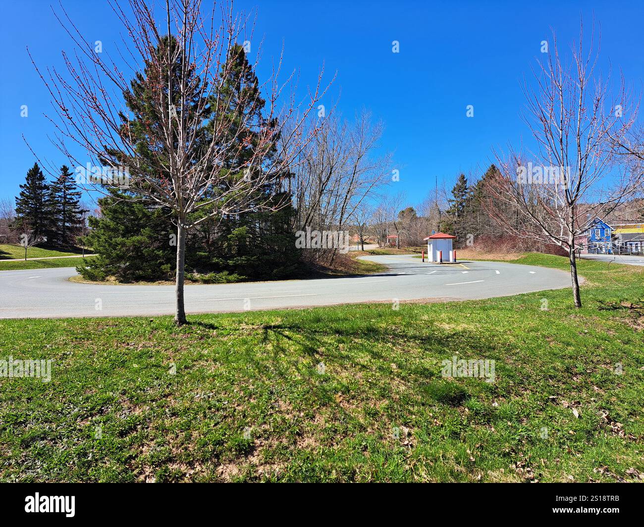 Kiosk and road to drive the hill at Magnetic Hill in Moncton, New ...