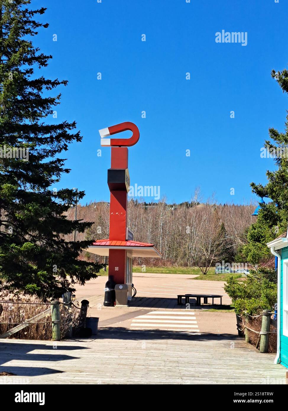 Magnetic Hill sign and kiosk in the parking lot in Moncton, New ...