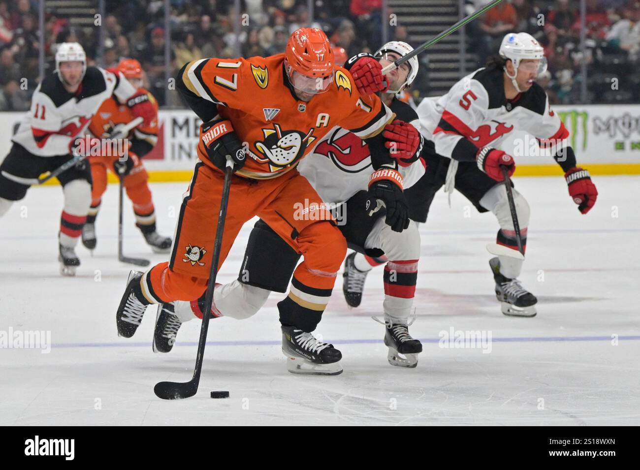 Anaheim Ducks left wing Alex Killorn, left, and New Jersey Devils ...