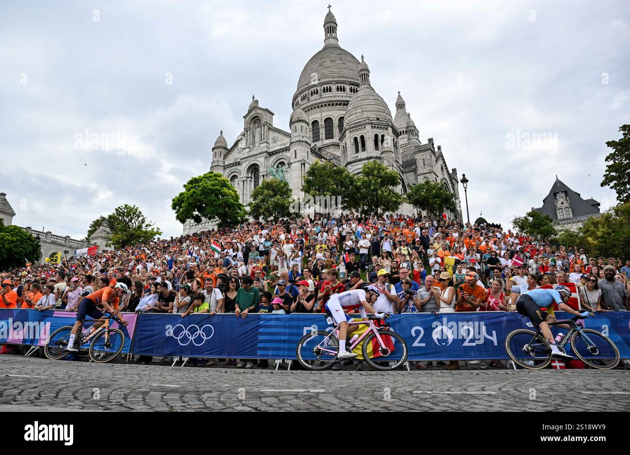 Beijing, France. 3rd Aug, 2024. Spectators watch the men's cycling road ...