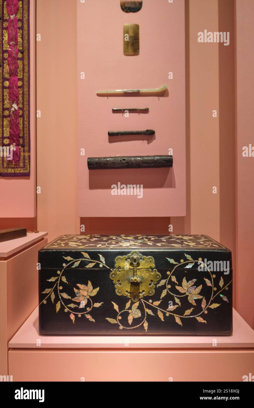 A fancy wood chest with mother of pearl vine inlay and a selection of ...