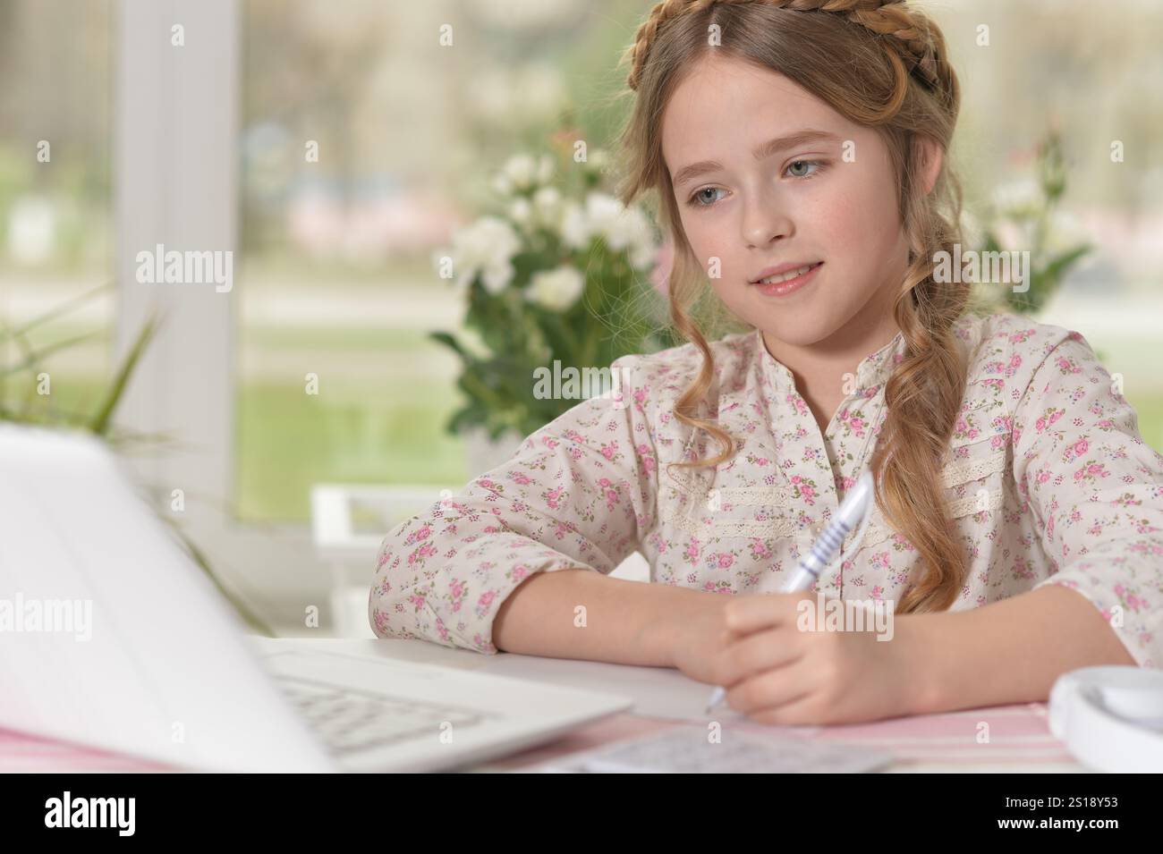 Cute and happy little girl children using laptop computer Stock Photo ...