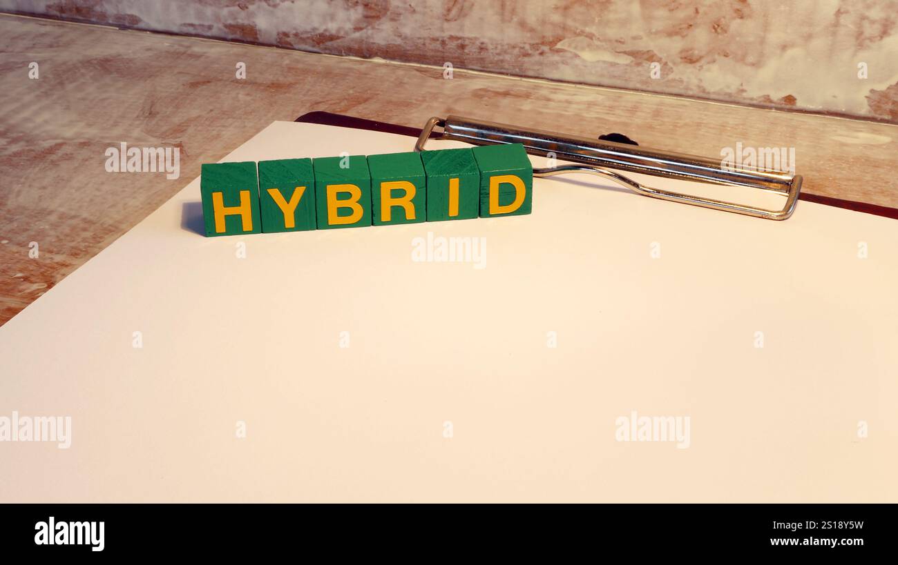 Single word HYBRID in block letters with wooden cubes, term used in the ...