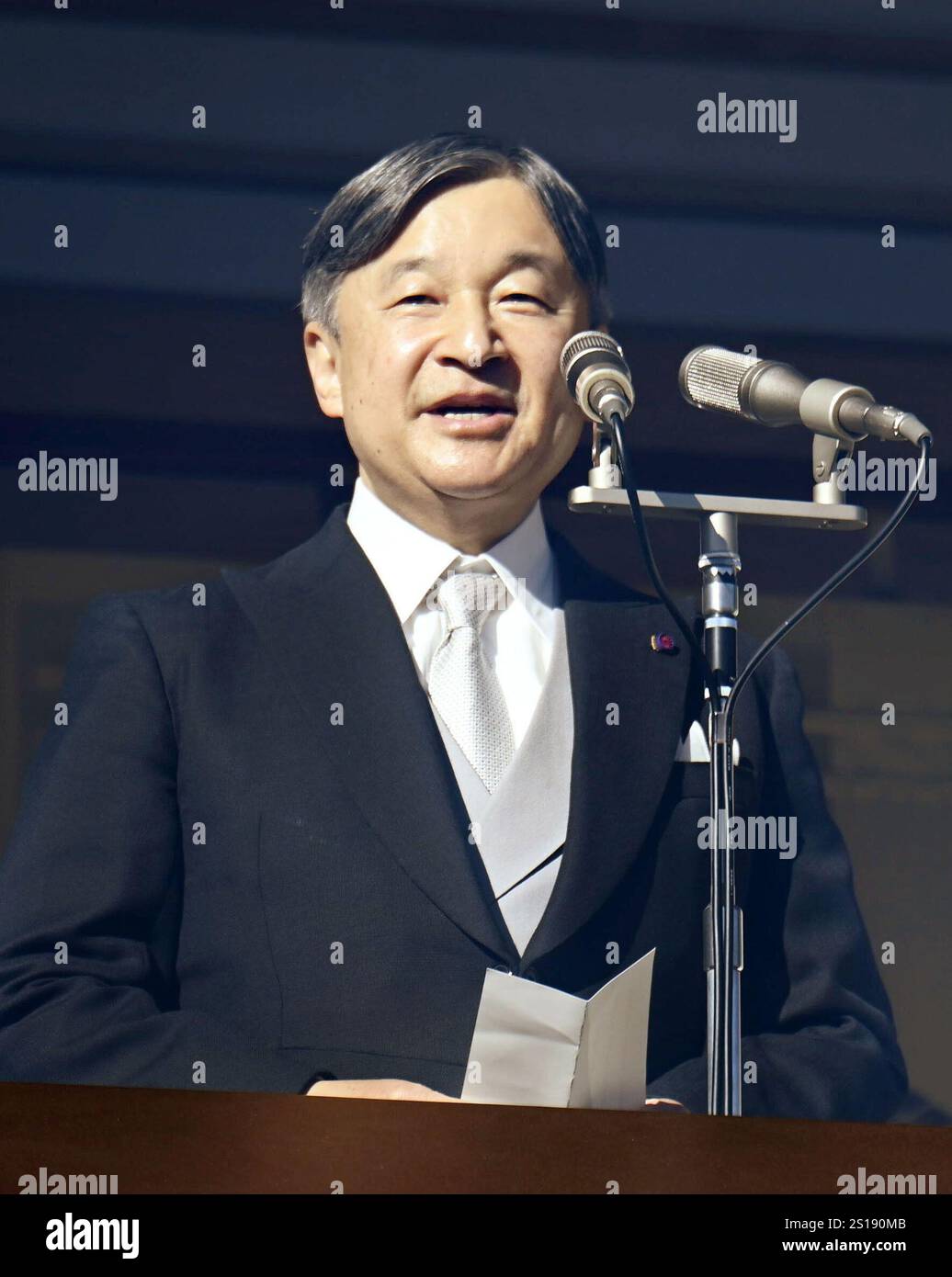 Japanese Emperor Naruhito speaks to well-wishers from a balcony at the ...