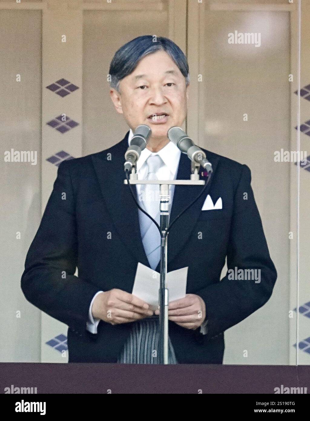 Japanese Emperor Naruhito speaks to well-wishers from a balcony at the ...