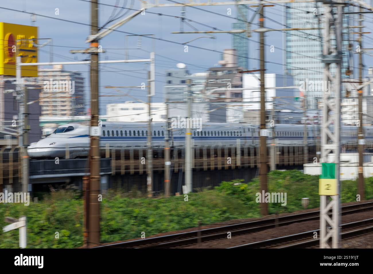 Japan's sleek Nozomi Shinkansen Bullet Train, heading for Yokohama, is seen heading out set ...