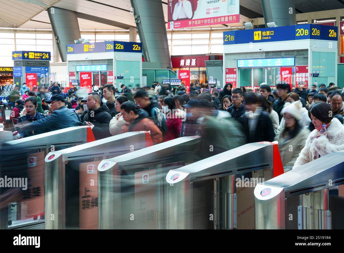 Beijing,China.1st January 2025. Passengers pass through ticket barrier ...