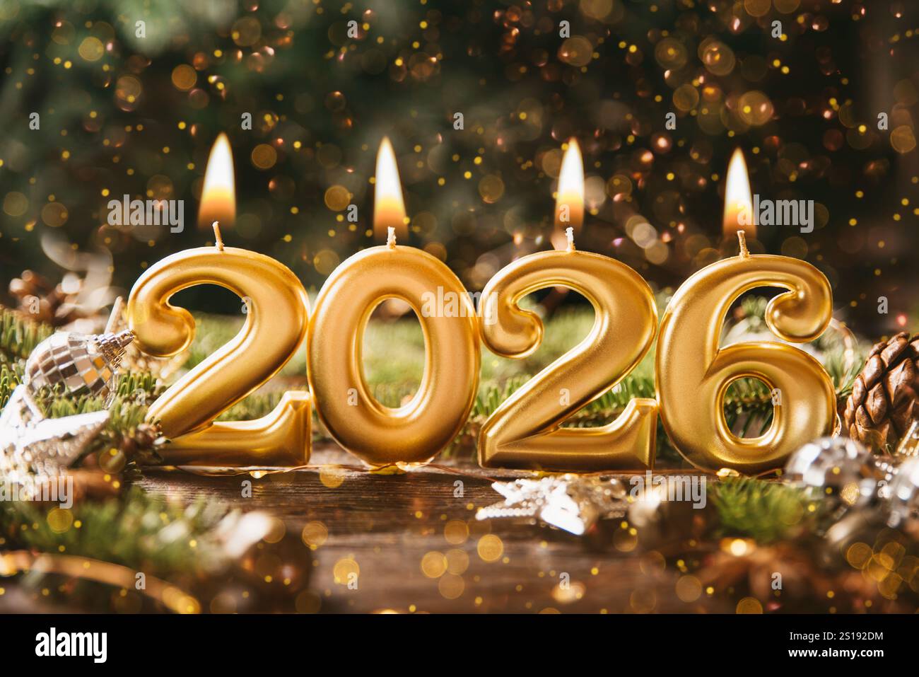 Holiday background Happy New Year 2026. Numbers of year 2026 made by gold burning candles on ...