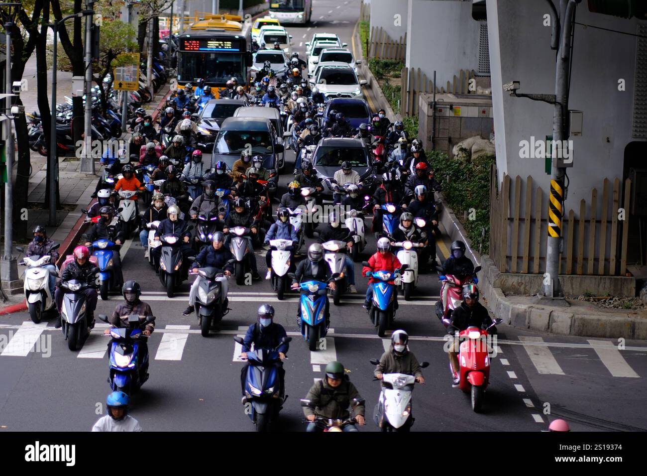 Several early morning commuters ride motorbikes as a preferred means of ...