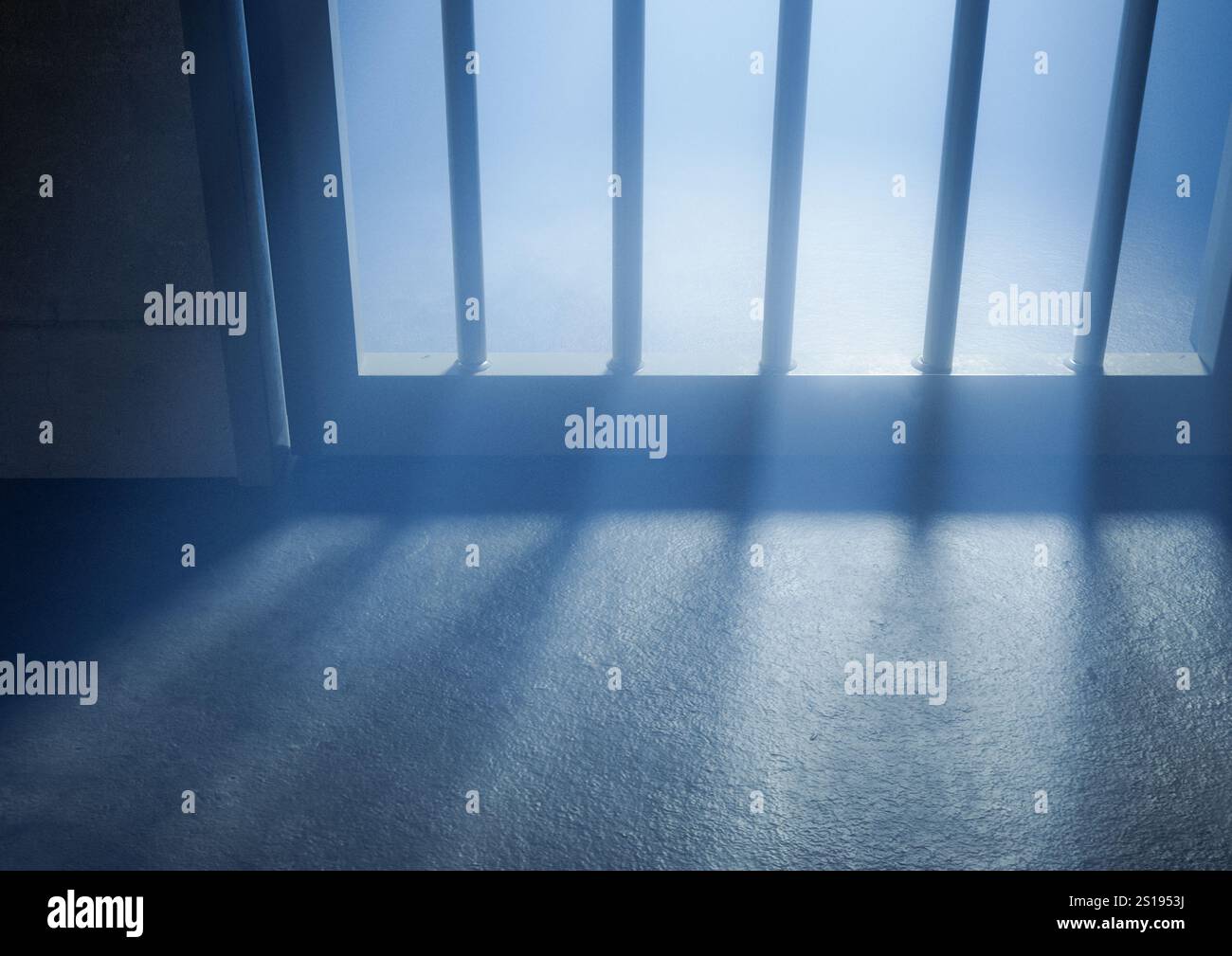 A closeup of a spolight behind jail cells iron bars casting shadows on the concrete prison floor ...