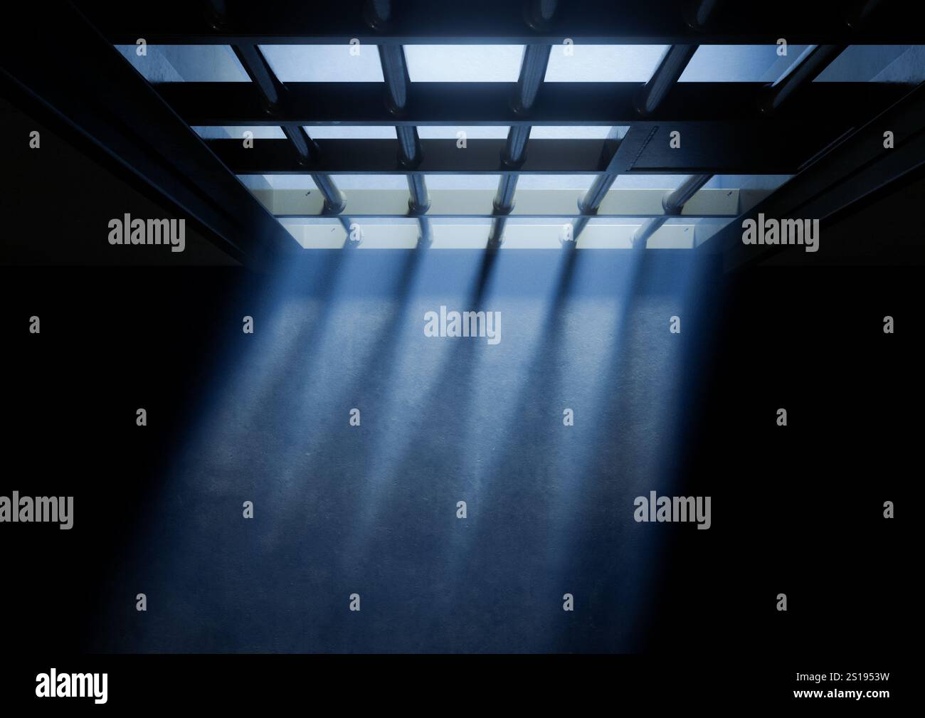 A closeup of a spolight behind jail cells iron bars casting shadows on the concrete prison floor ...