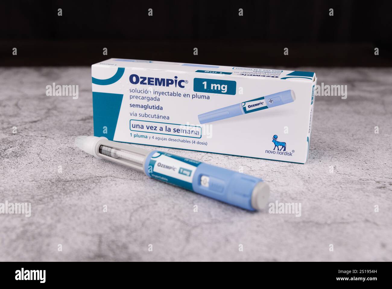 Visual of Ozempic 1 mg Medication and Blue Dosing Device on Concrete ...
