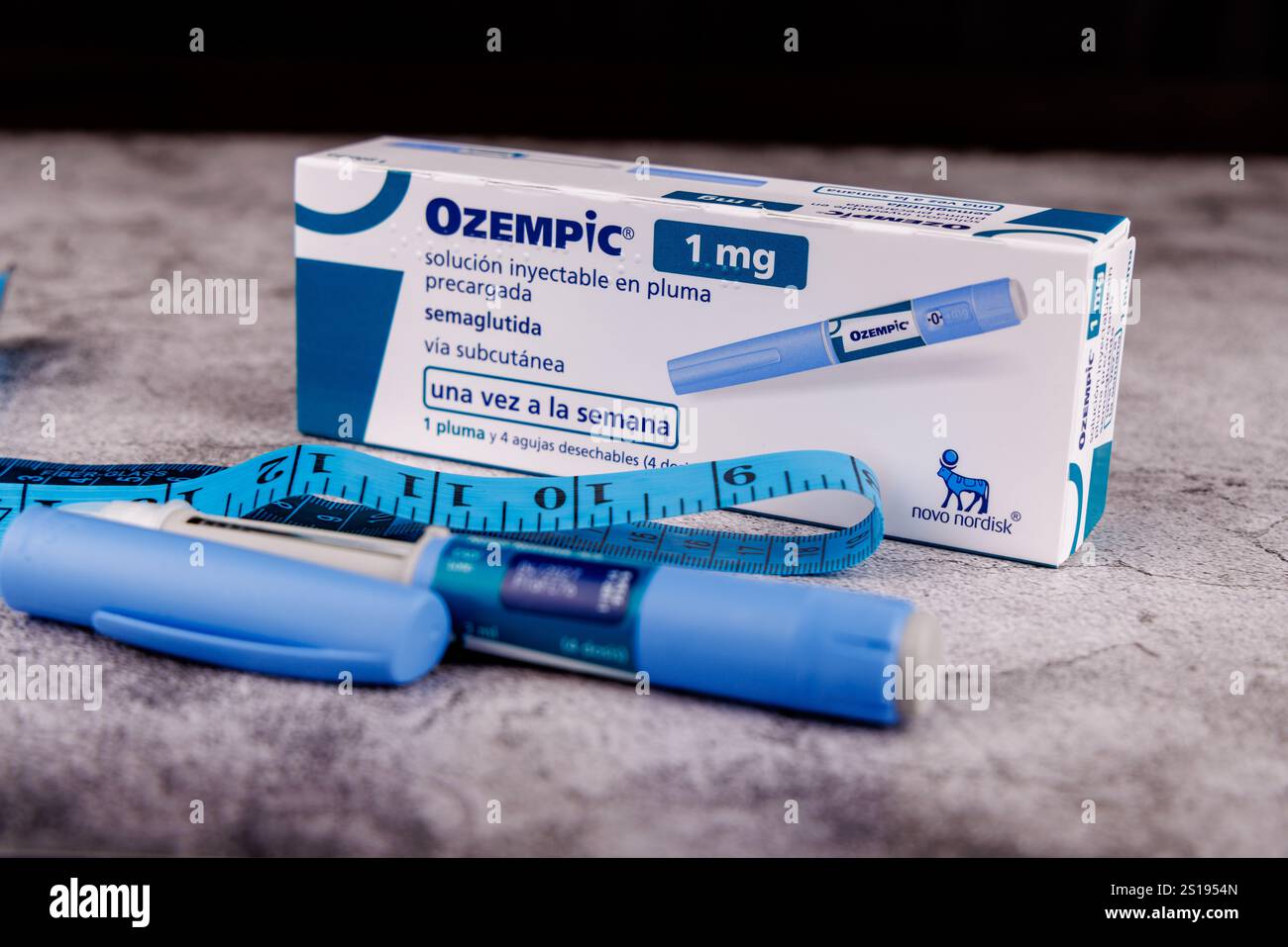 Close-Up of Ozempic 1 mg Medication and Blue Dosing Device on Concrete ...