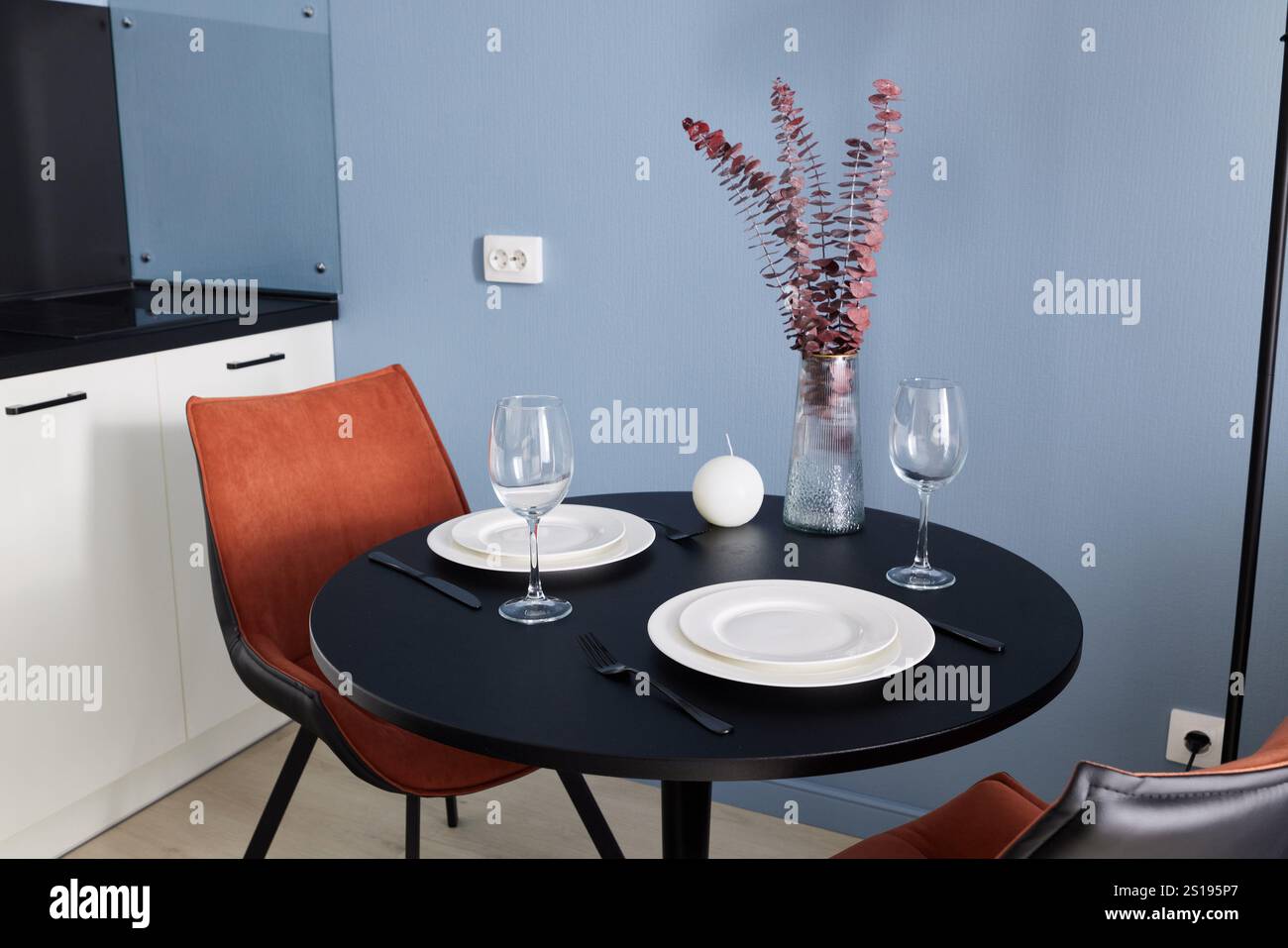 An Elegant Dining Setup Featuring a Beautiful Floral Centerpiece in a ...