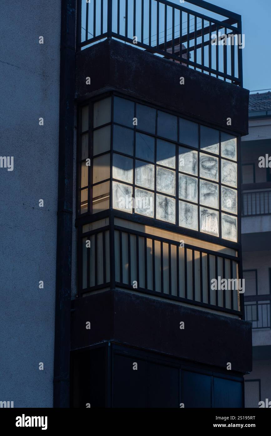 Sunrise Glow: Square Windows and a Balcony Corner of Hope Stock Photo ...