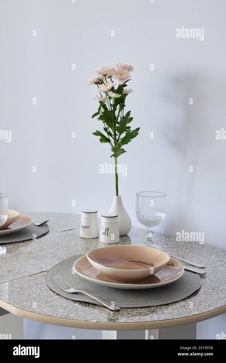 An elegantly arranged dining table featuring exquisite dishware ...