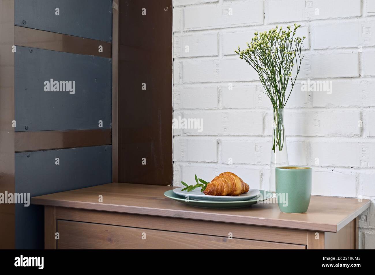 A Beautiful and Elegant Breakfast Scene Featuring a Croissant Alongside ...