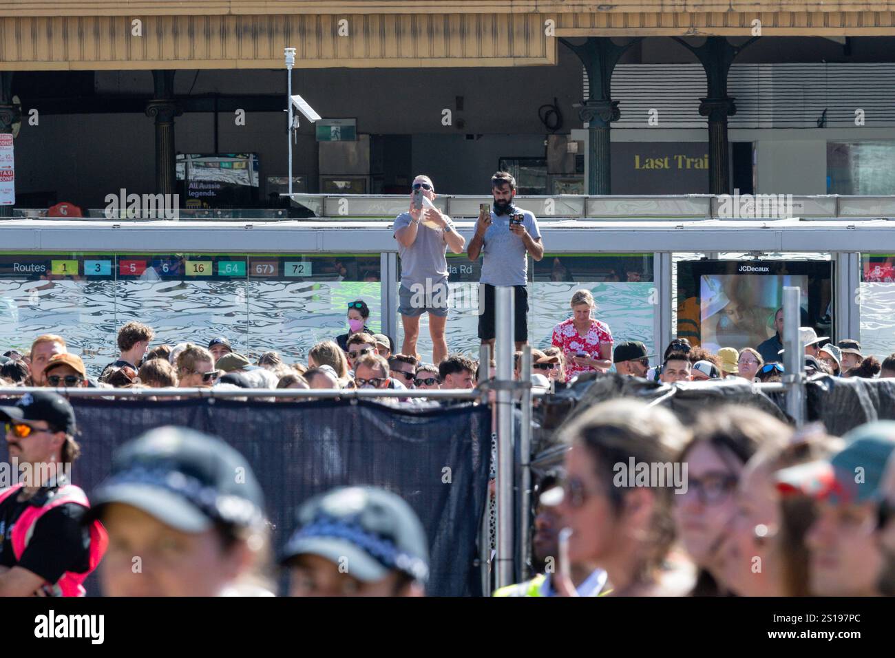 Fans who were locked out try to get a view of Robbie Williams as he ...