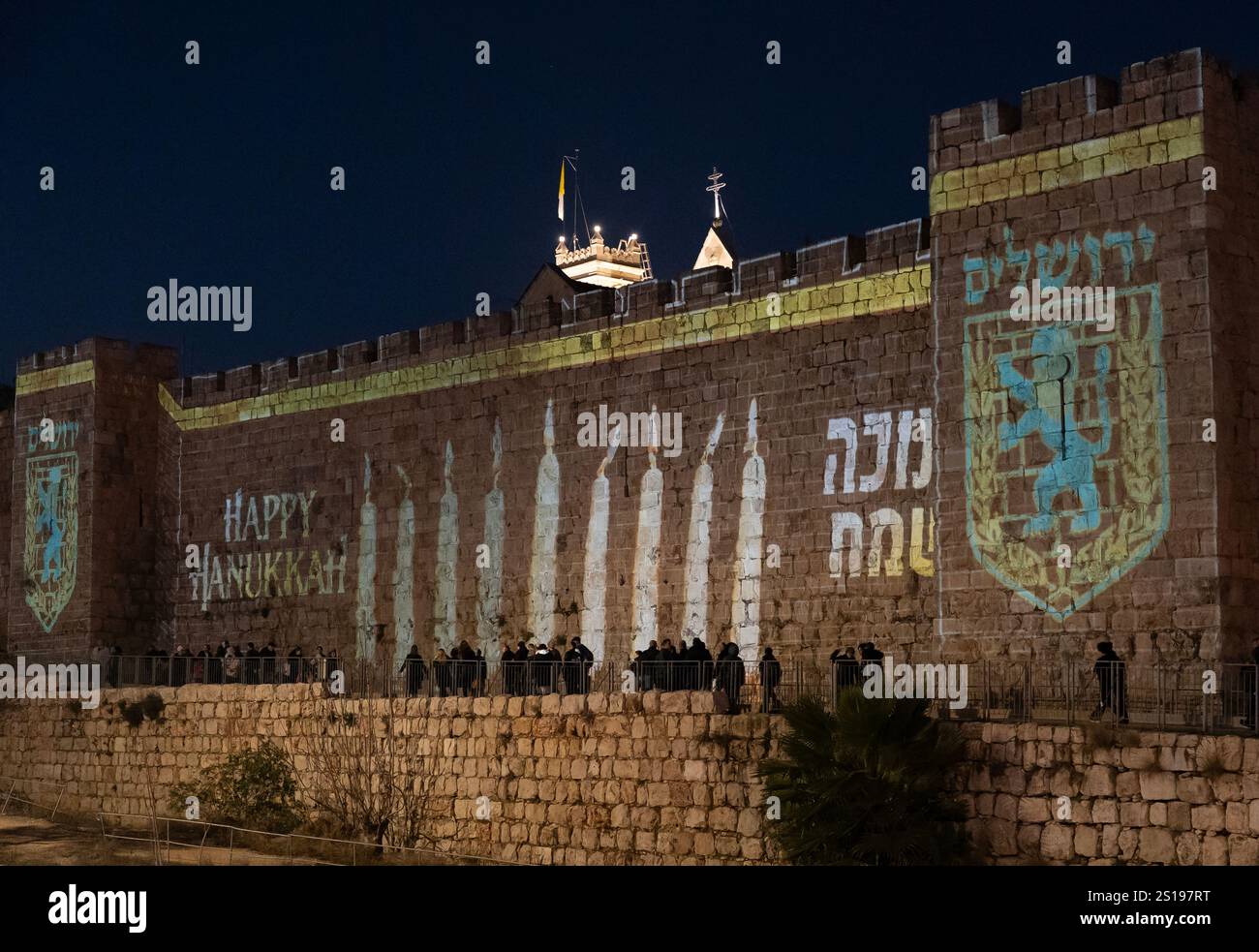 The Jewish Menorah candelabrum is projected onto the walls of the old ...