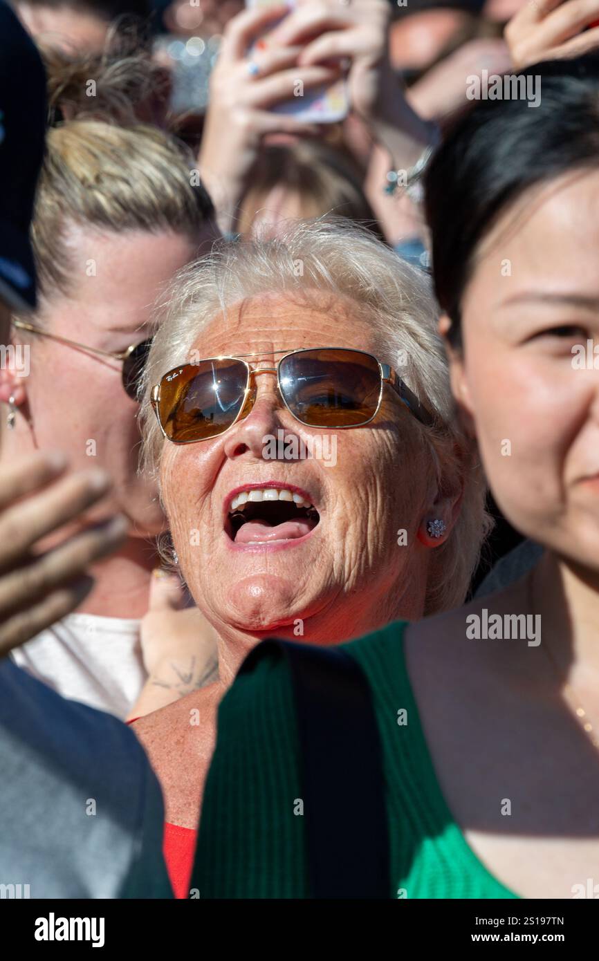 A fans sings her heart out as Robbie Williams takes the stage for an ...