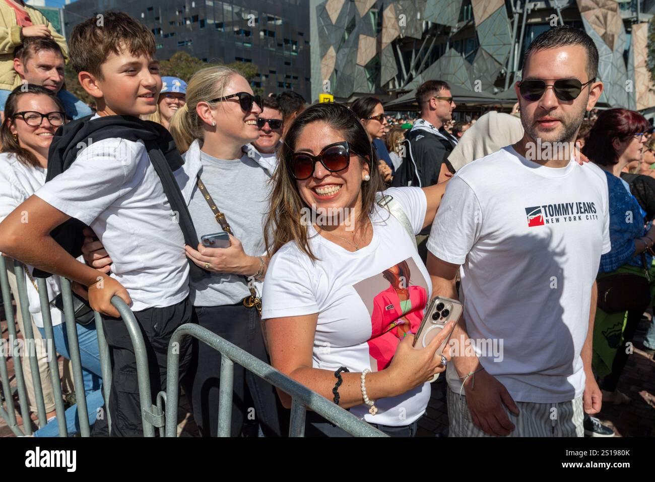 Fans cheer with excitement as Robbie Williams takes the stage for an ...