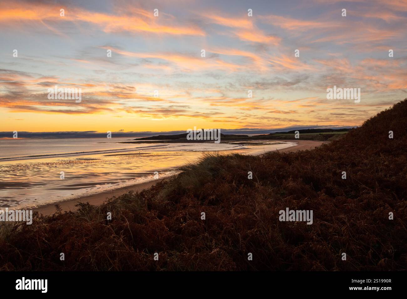 Autumn sunrise over Embleton Bay and Dunstanburgh Castle Stock Photo ...