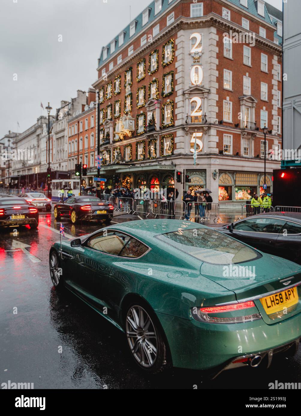 British cars on Piccadilly, outside Fortnum and Mason at the New Year ...