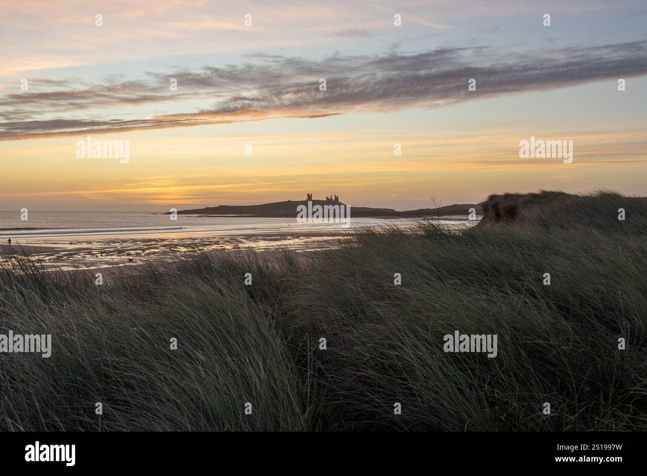 Autumn sunrise over Embleton Bay and Dunstanburgh Castle Stock Photo ...