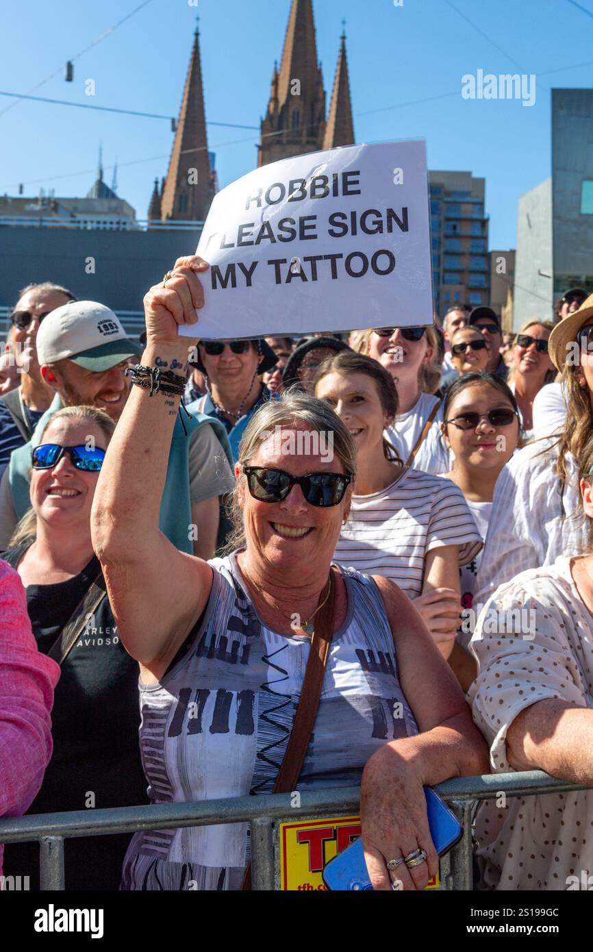 Melbourne, Australia, 02/01/2025, A fans holds a sign for Robbie ...