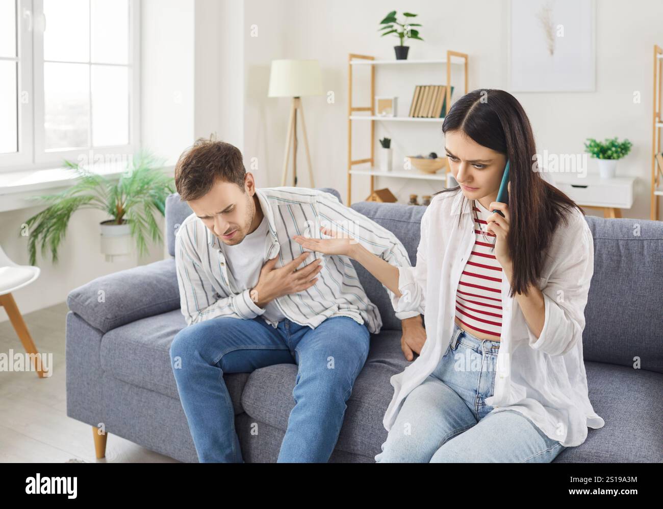 Man in his 30s at home having heart attack and suffering from chest ...