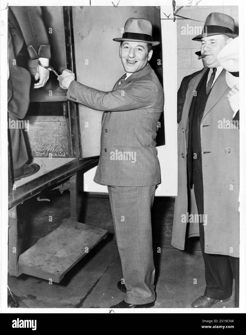 Gangster and mobster Louis Lepke Buchalter handcuffed to guard, getting ...