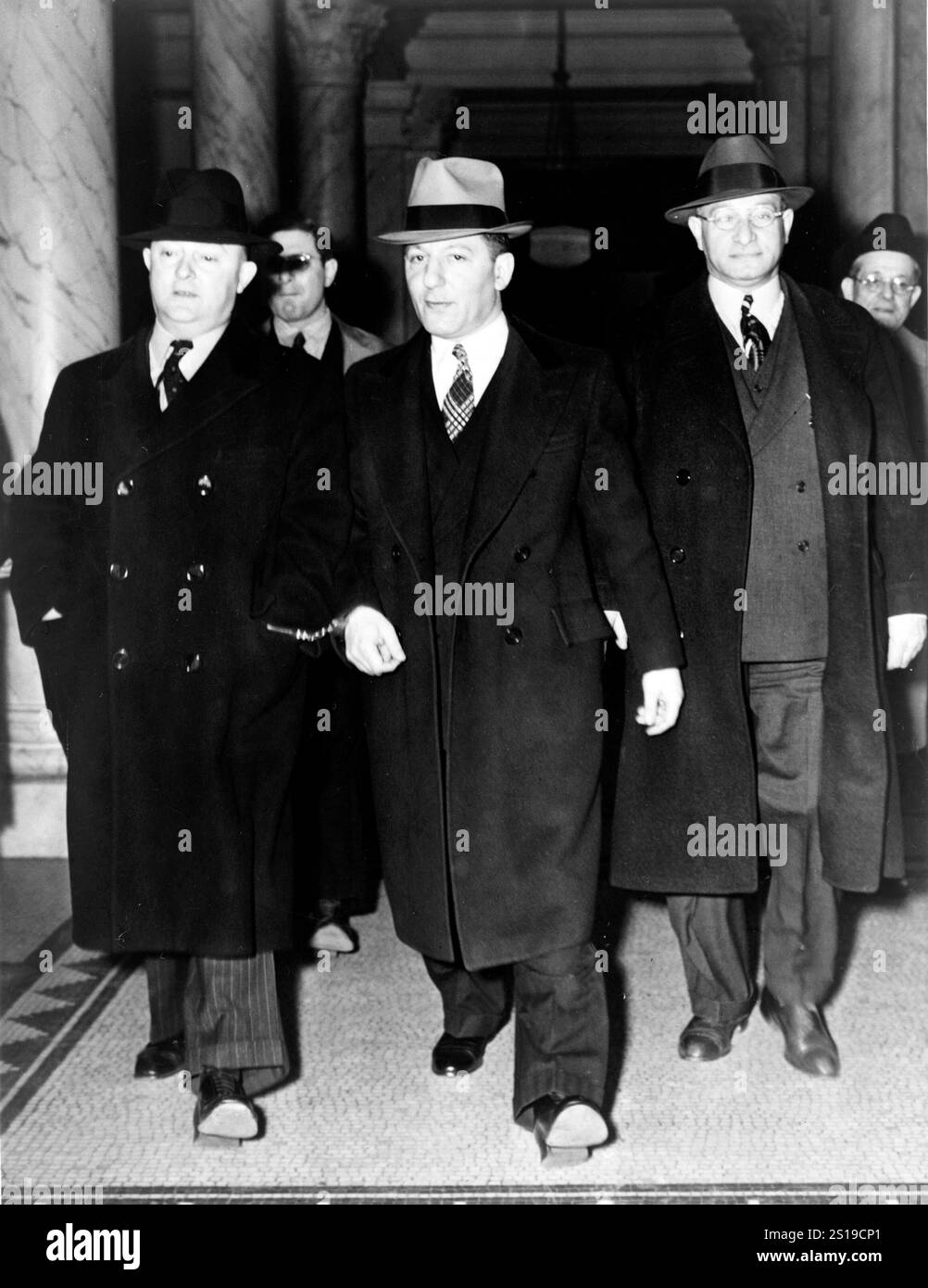 Louis "Lepke" Buchalter, center, handcuffed to J. Edgar Hoover, on the ...