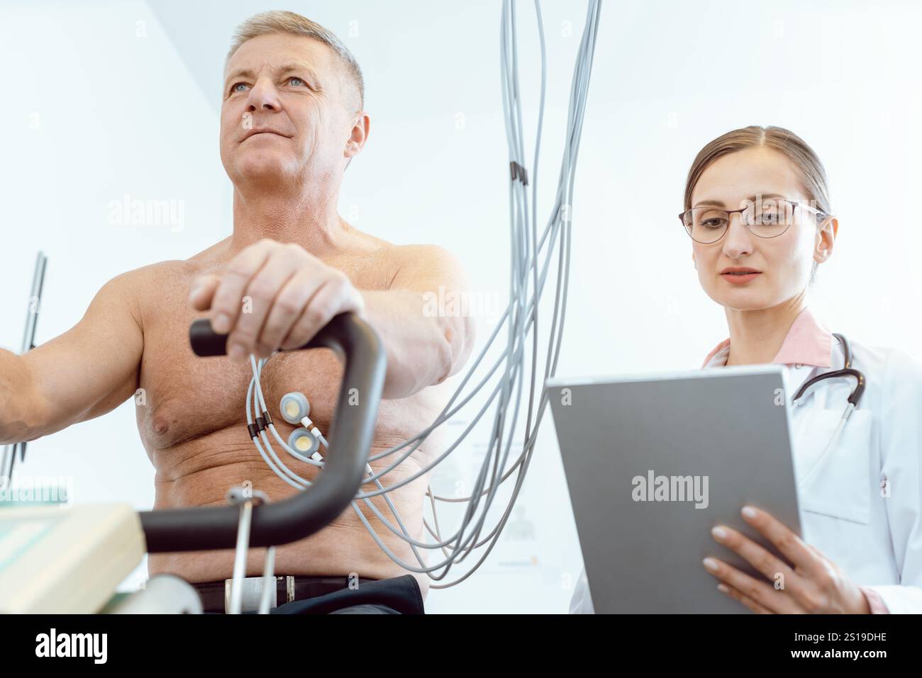 Doctor taking notes on tablet hi-res stock photography and images - Alamy