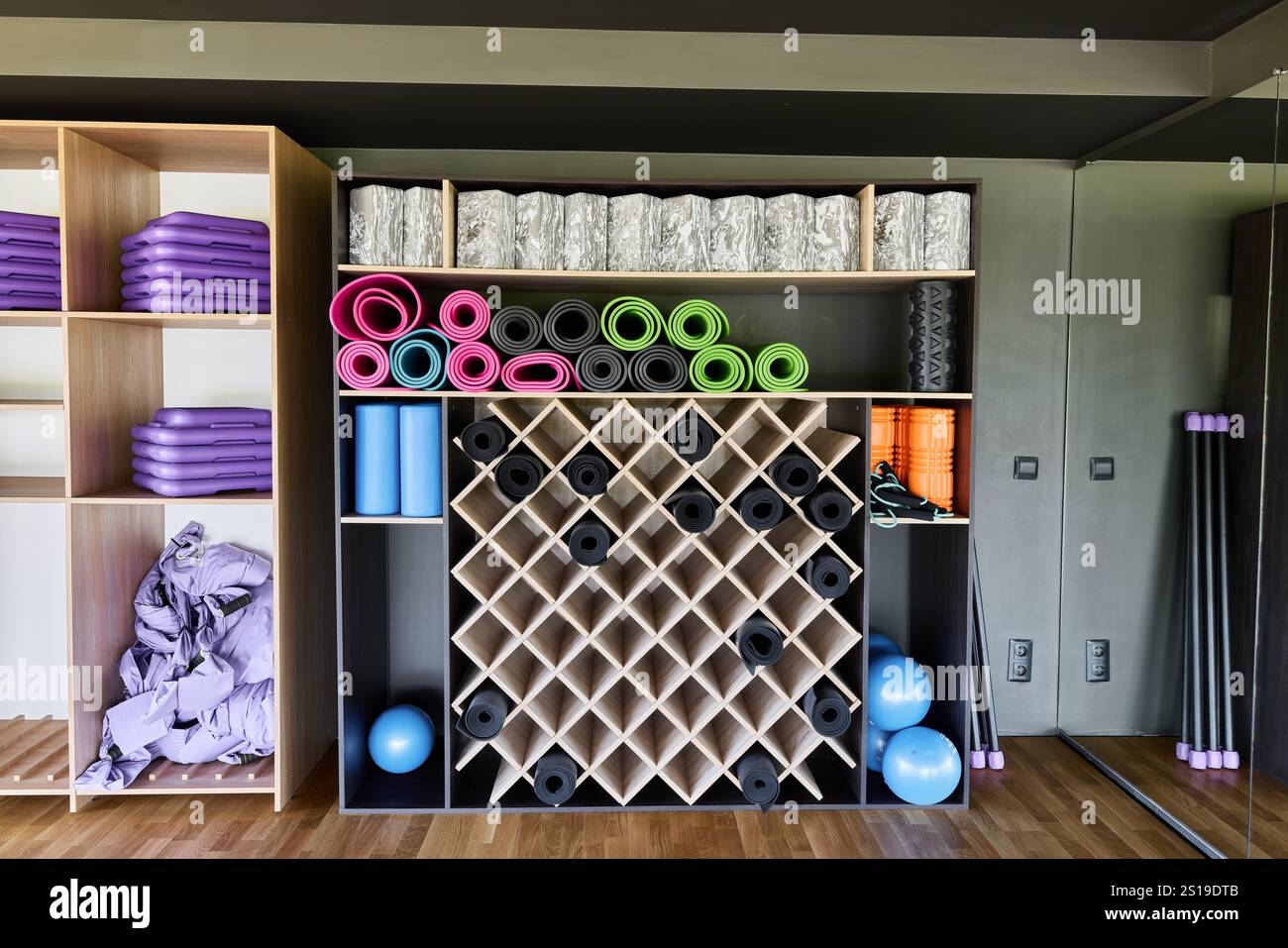 A vibrant assortment of colorful fitness equipment displayed ...