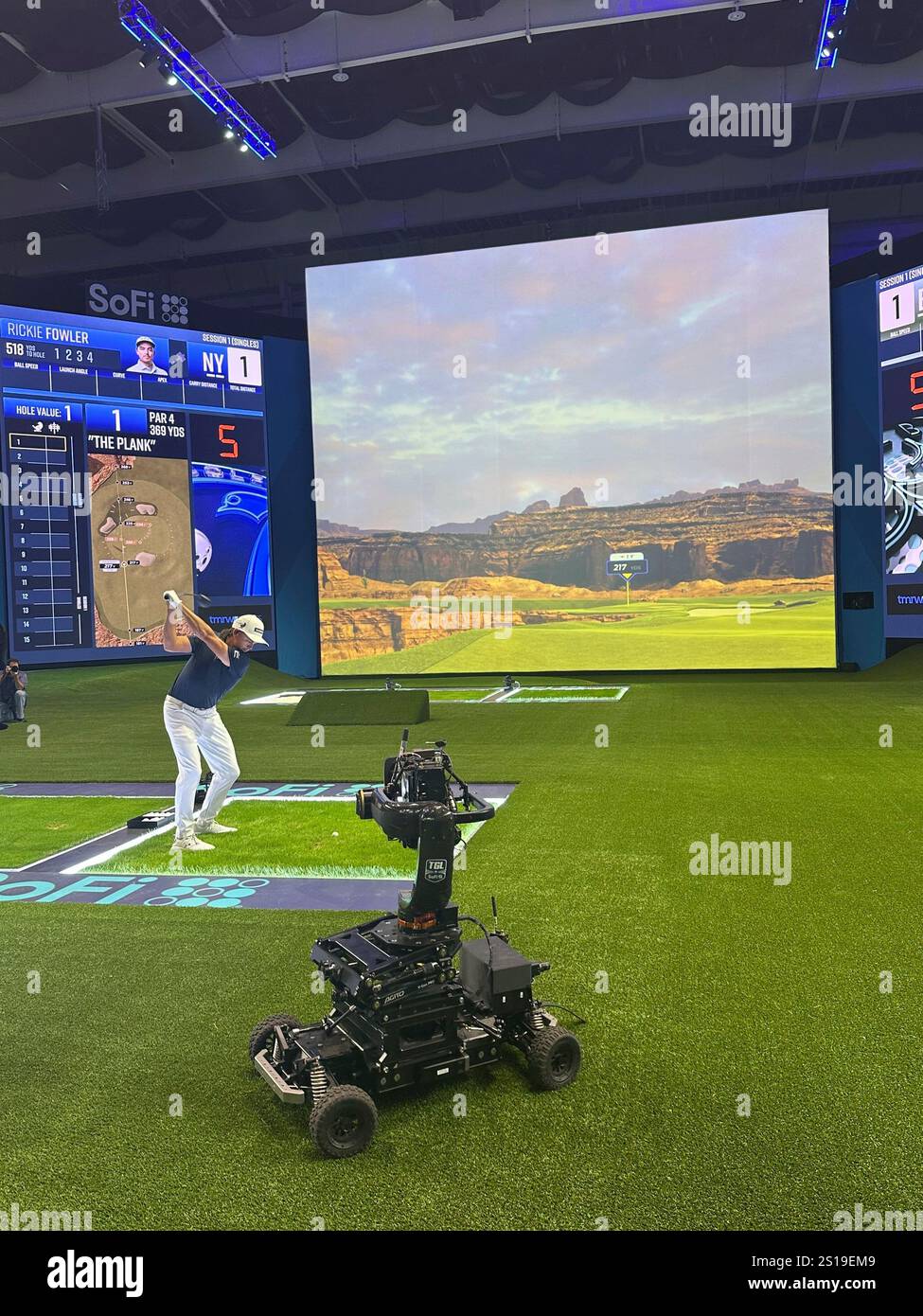 Rickie Fowler hits into the massive simulator screen at the SoFi Center ...