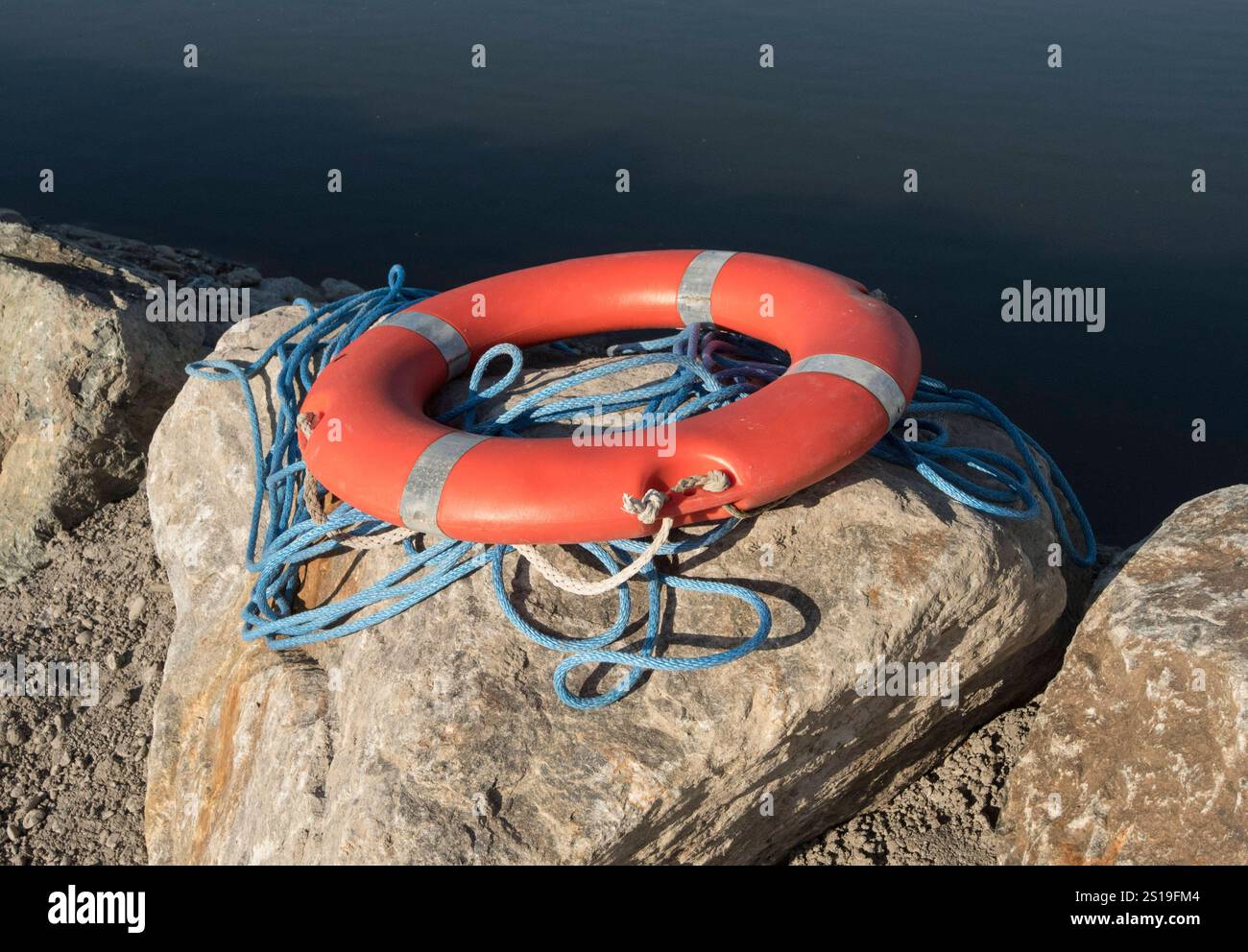 life belt with warning sign on risks and hazards in seafaring and ...