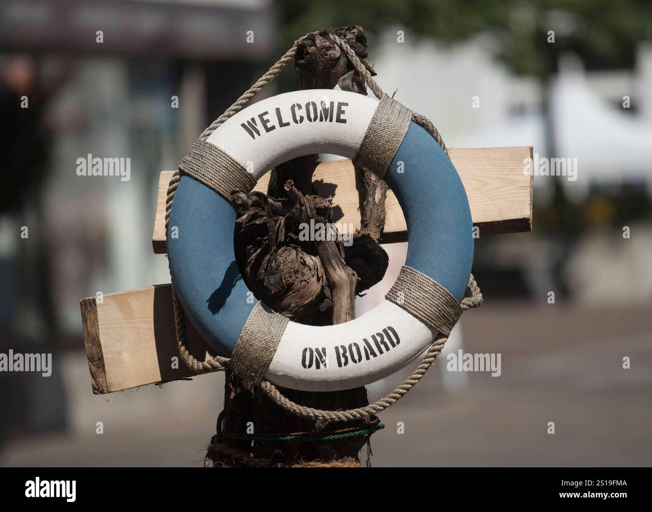 life belt with warning sign on risks and hazards in seafaring and ...